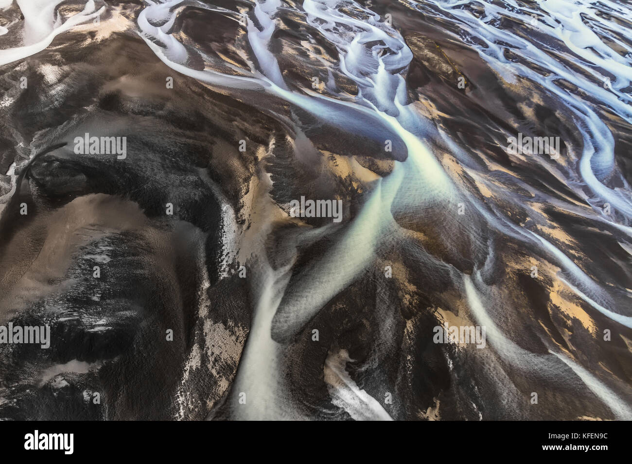 River Shapes in the Black Sand Stock Photo - Alamy