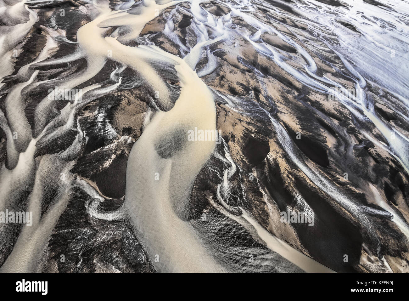 River Shapes in the Black Sand Stock Photo - Alamy