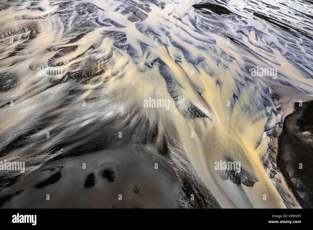 River Shapes in the Black Sand Stock Photo - Alamy