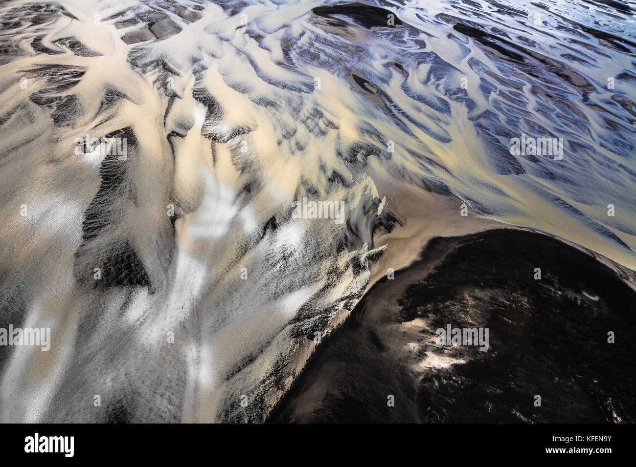 River Shapes in the Black Sand Stock Photo - Alamy