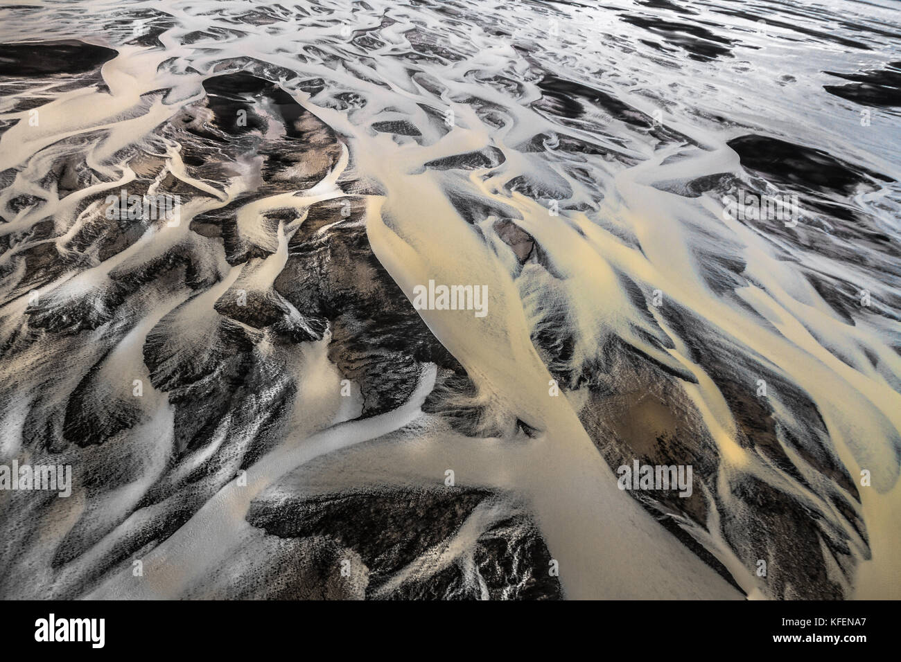 River Shapes in the Black Sand Stock Photo - Alamy
