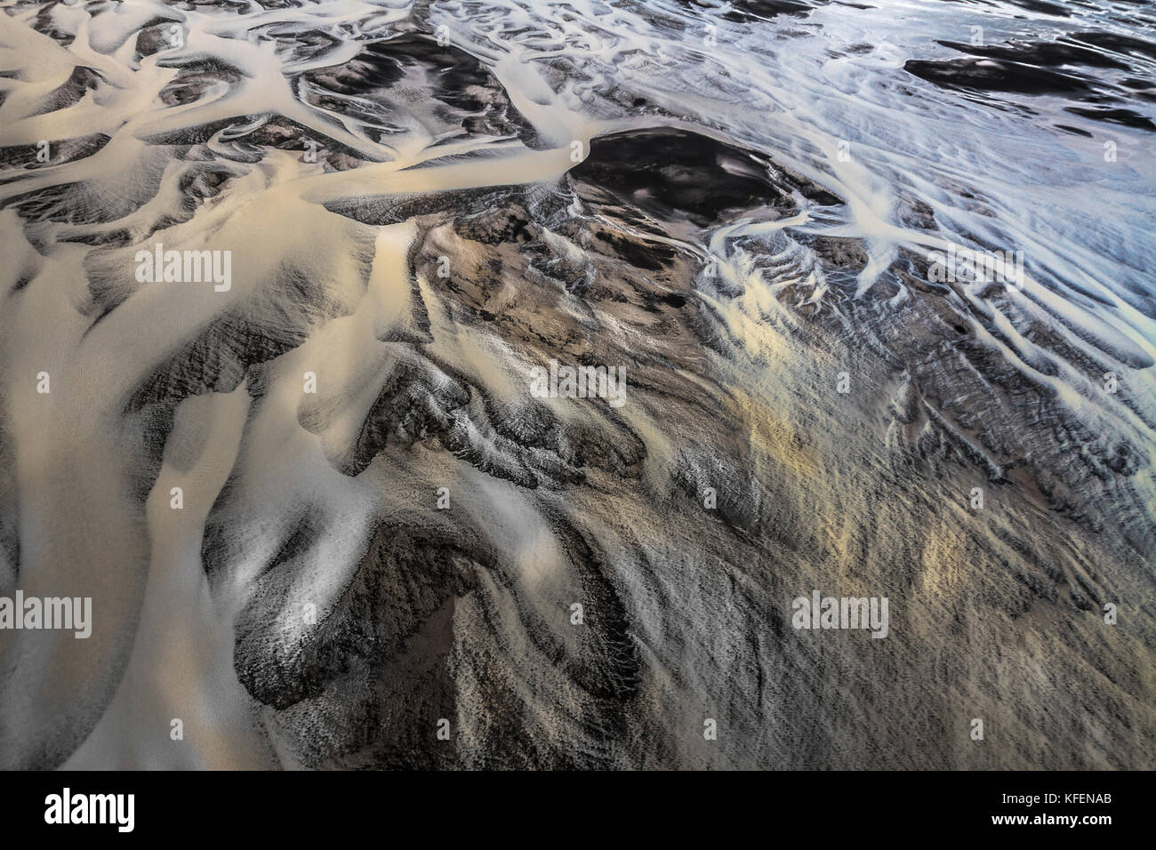 River Shapes in the Black Sand Stock Photo - Alamy
