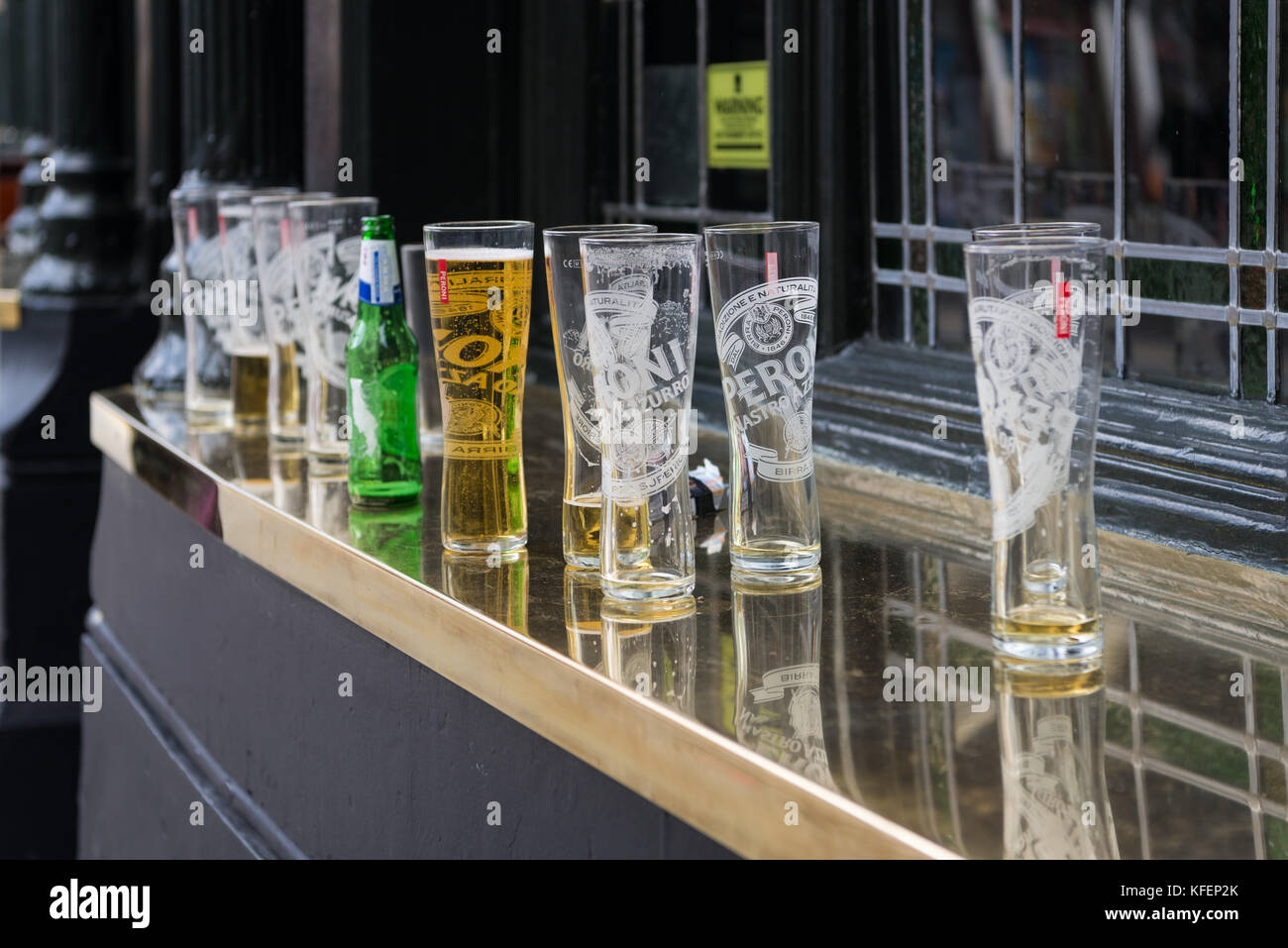 Used beer glasses on the outside windowsill of a public house Stock ...