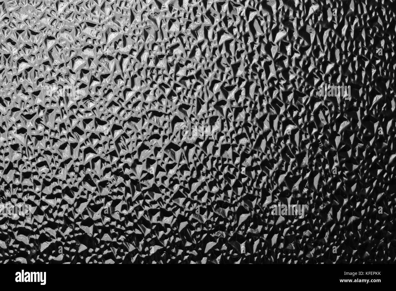 Ñorrugated glass surface tinted white color photo Stock Photo - Alamy