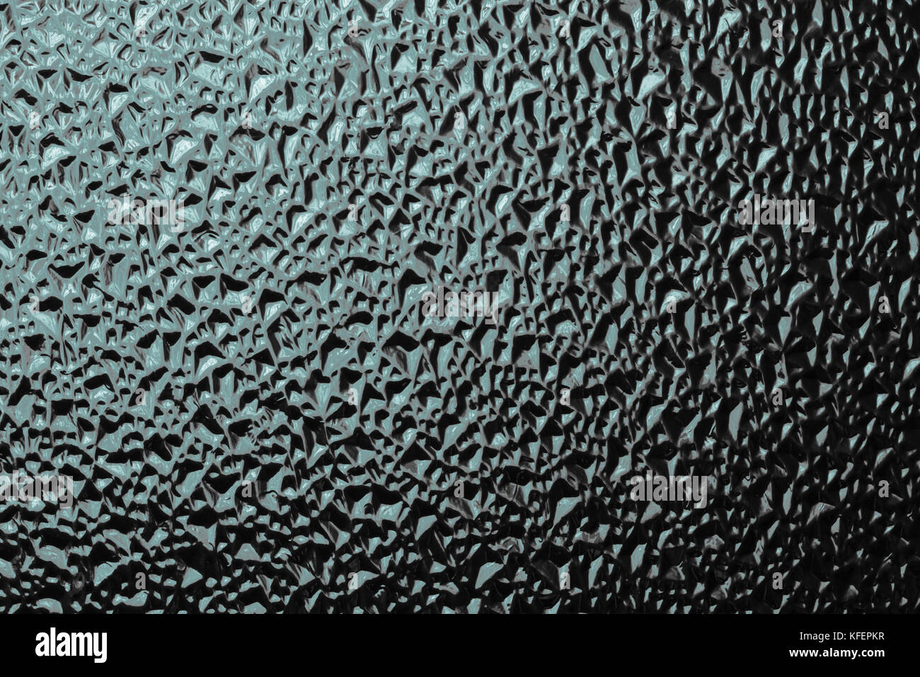 Corrugated glass surface tinted blue color photo Stock Photo - Alamy