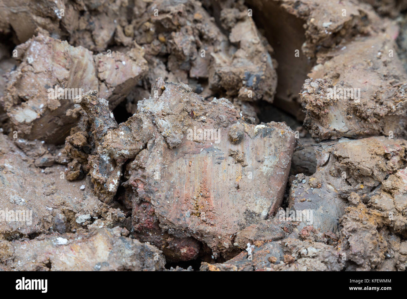 close up wet clod clay soil at the construction site or field ...