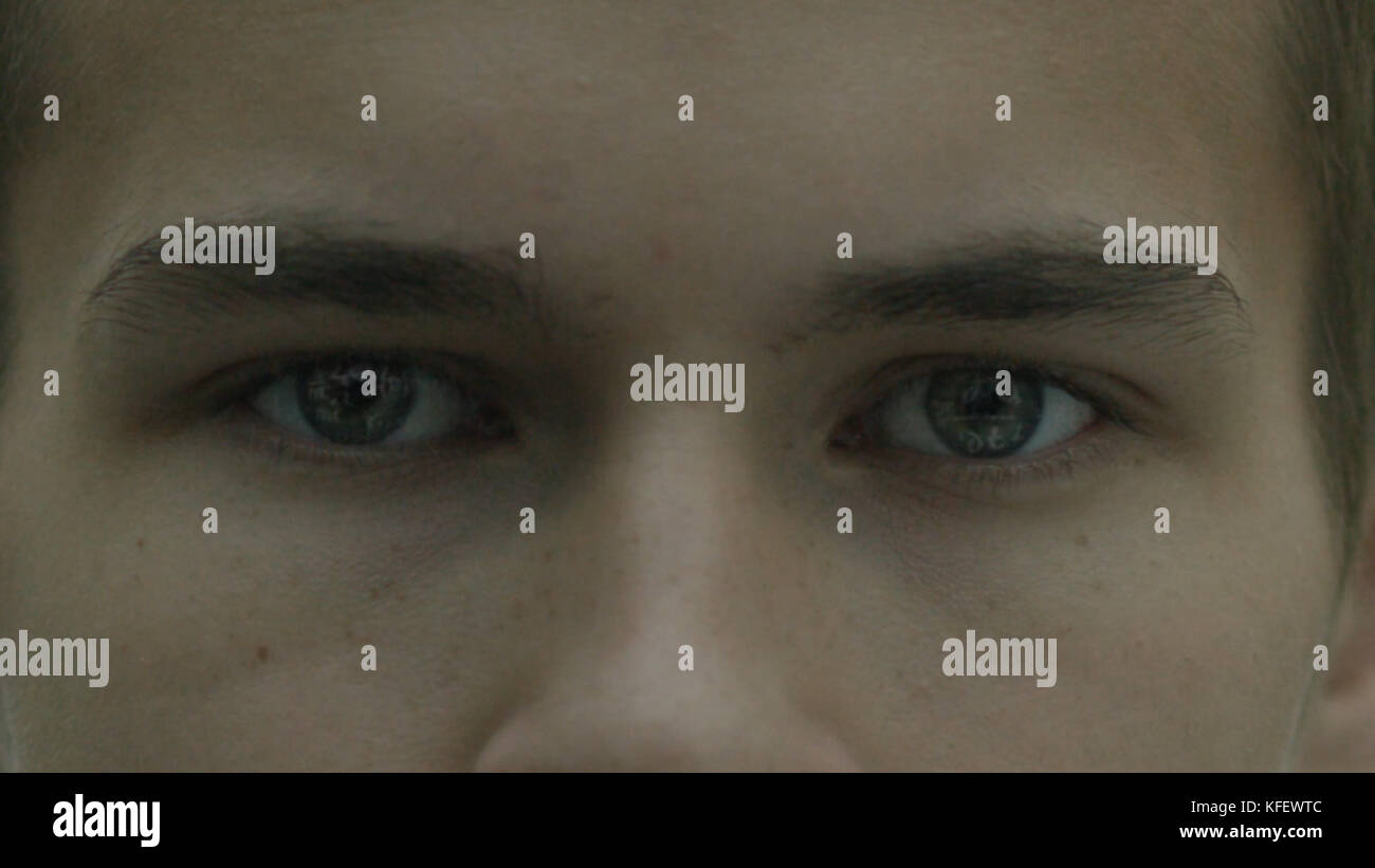 Close up shoot of insightful look human eyes. Attractive men's blue ...