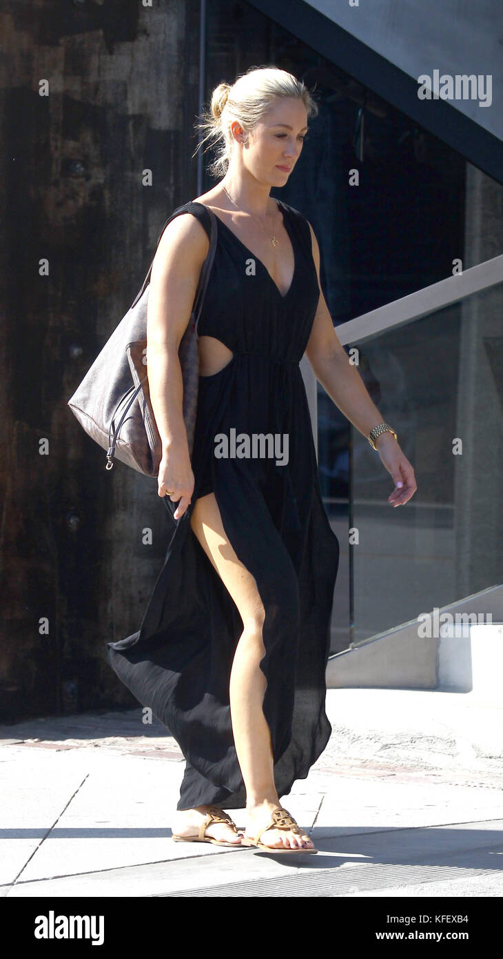 Caroline Pearce shows off her perfect figure whilst out and about in ...