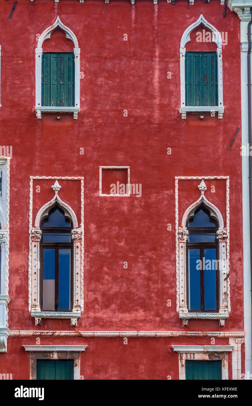 Colourful buildings such as this deep red coloured building along the ...