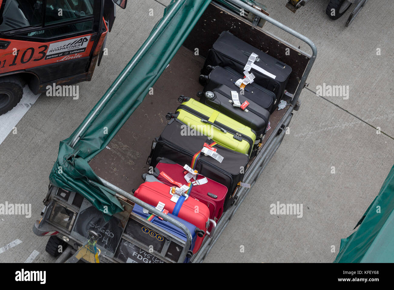 Top view of loading luggage of passengers before the flight departure ...