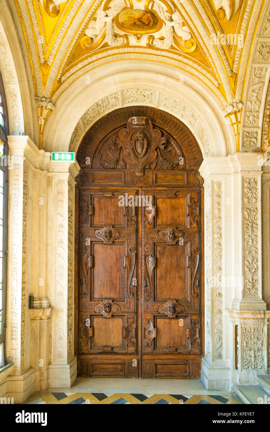 A large decorative wooden door in the Doge's Palace in Venice, Italy ...