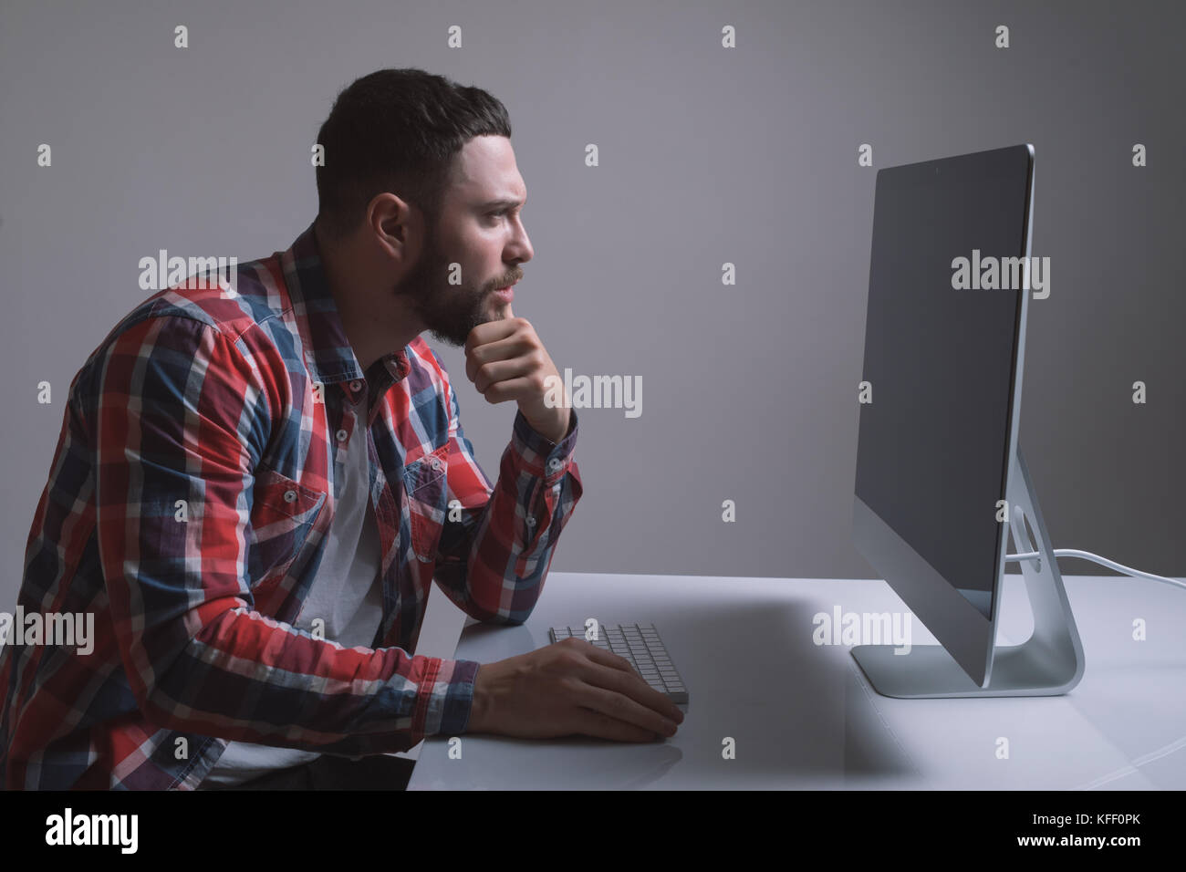 Man working on computer with isolated screen in office interior Stock ...