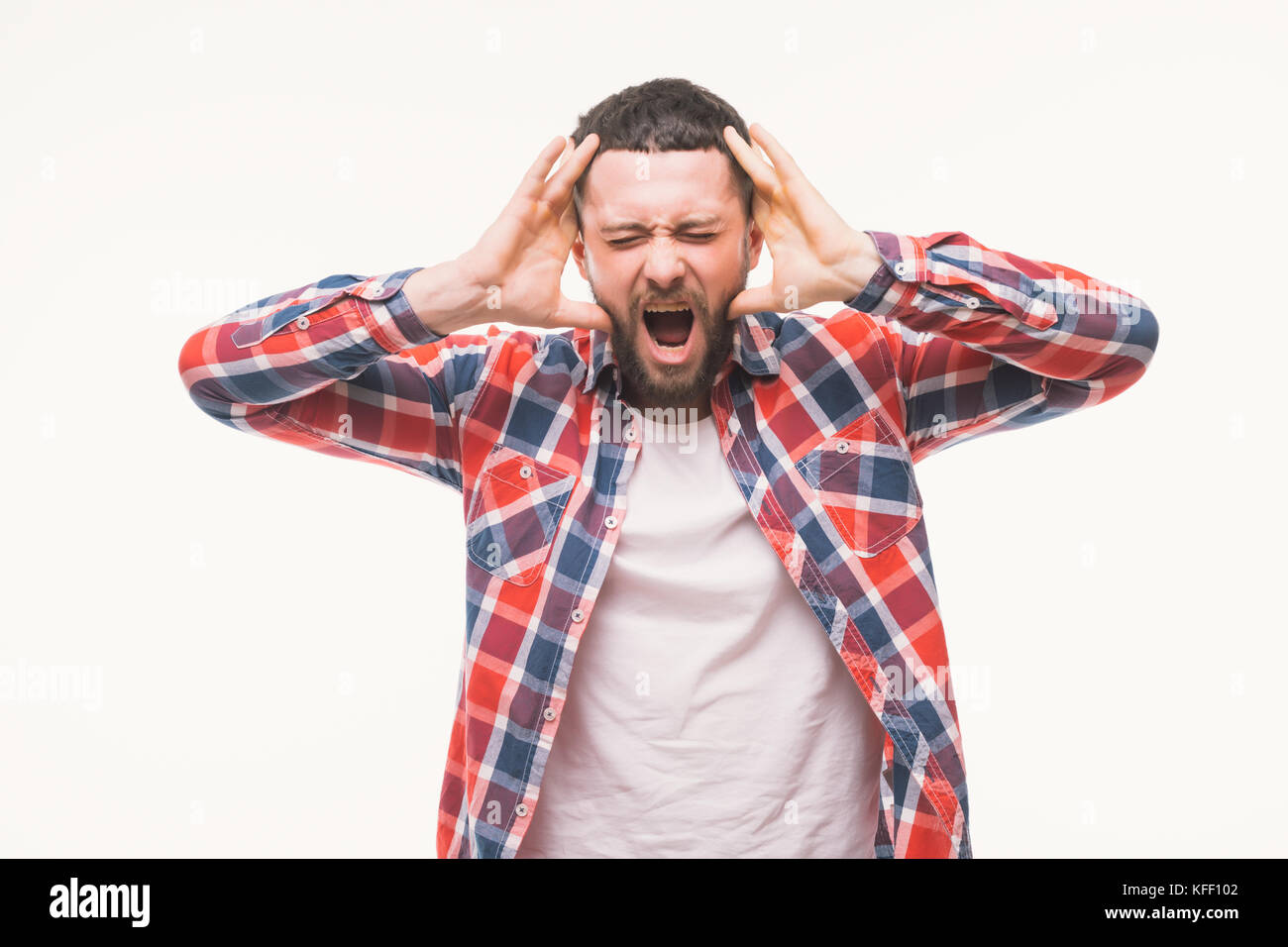 Screaming shocked bearded man in casual looking camera and screaming ...