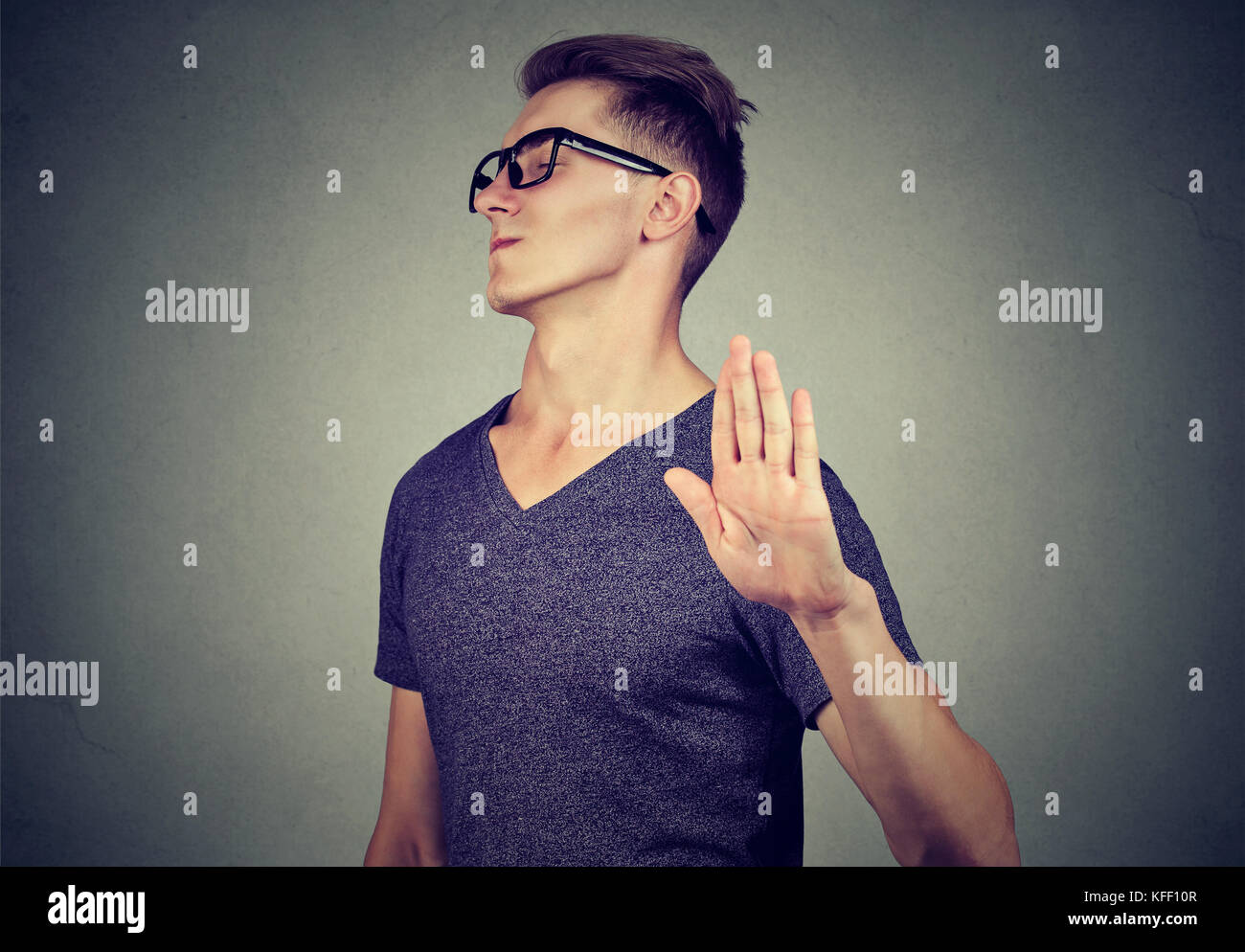 Annoyed angry man with bad attitude giving talk to hand gesture ...