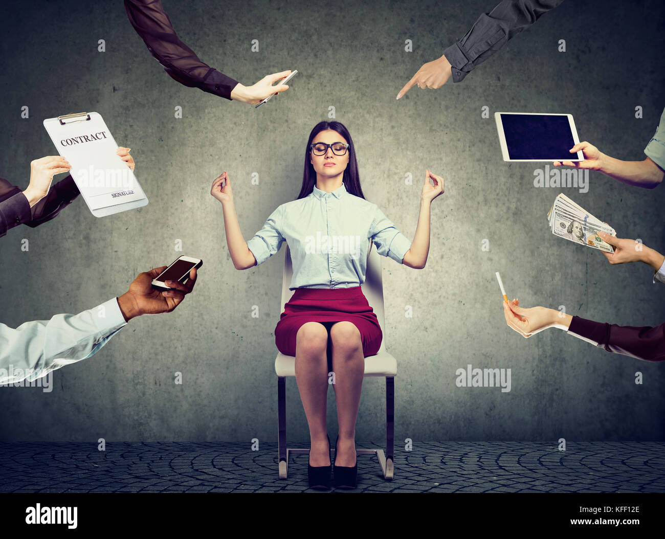 Young business woman is meditating to relieve stress of busy corporate ...
