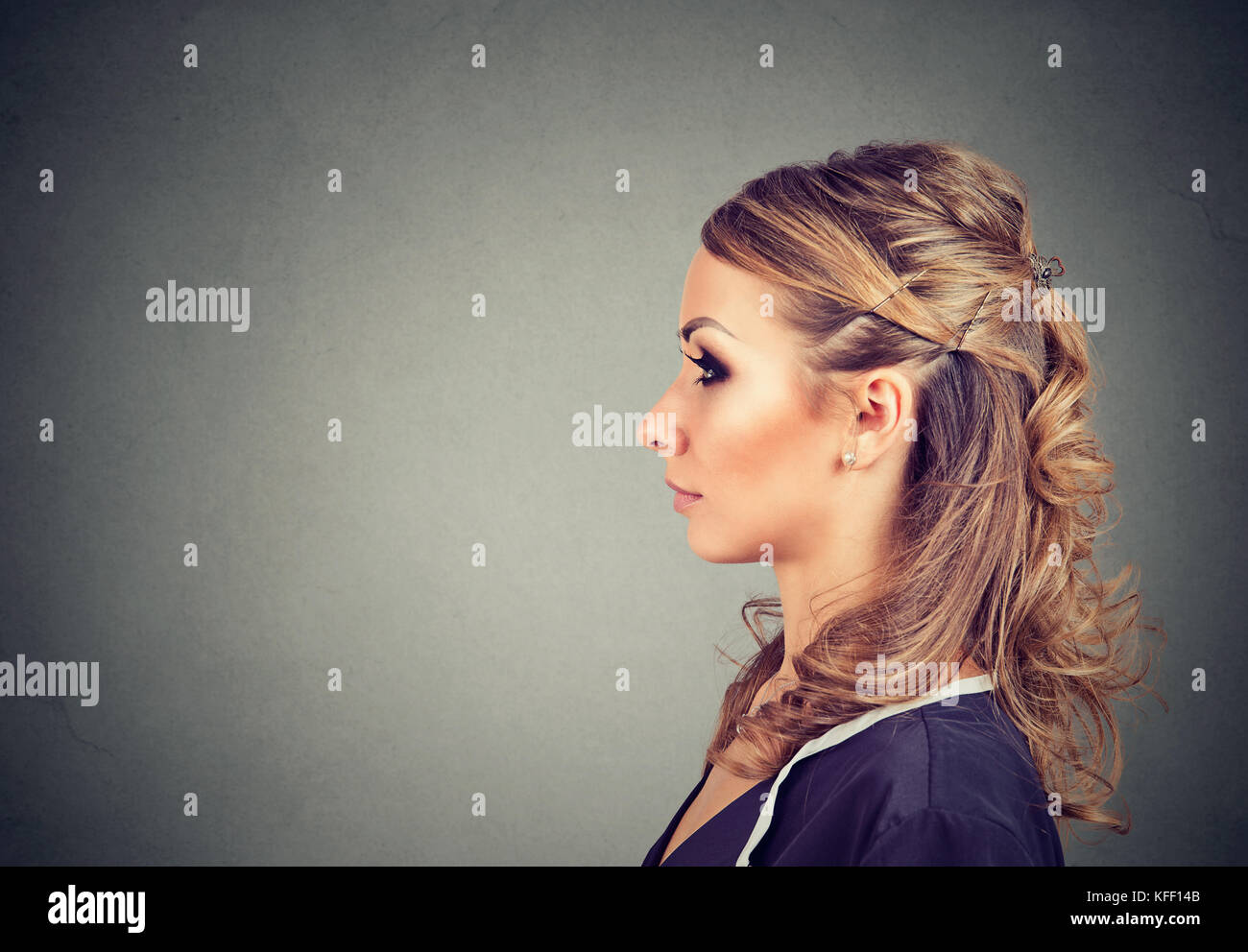 Side profile portrait of a beautiful serious woman Stock Photo - Alamy