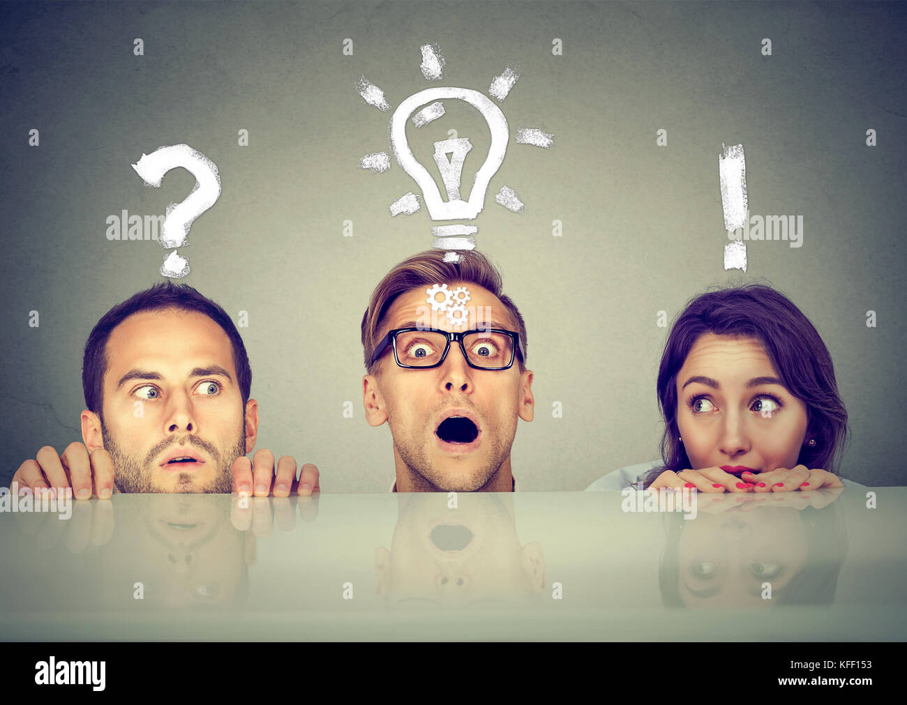 Scared anxious young people two men and a woman hiding peeking form ...