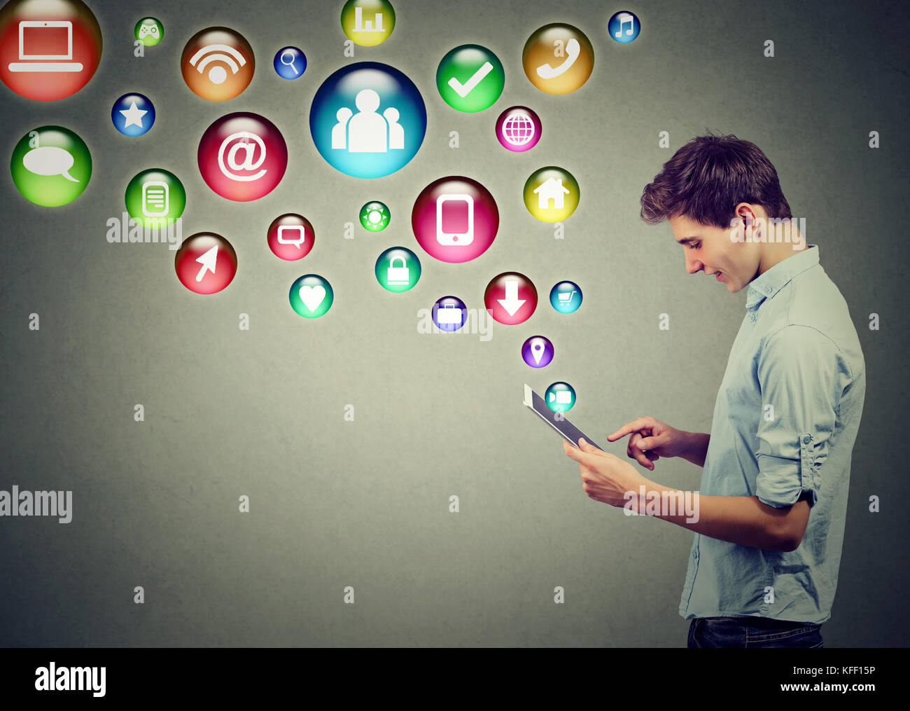 Mobile technology high tech concept. Side profile of a young man using ...