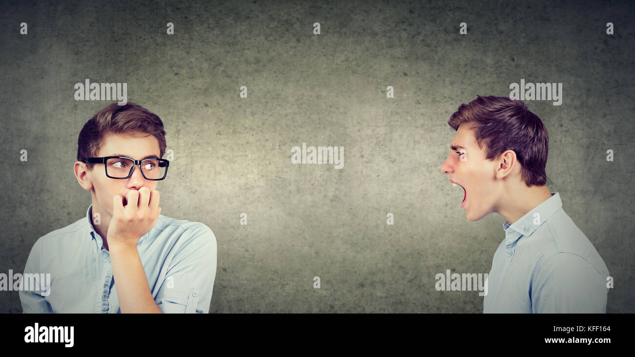 Split personality. Angry man screaming at scared anxious himself Stock ...