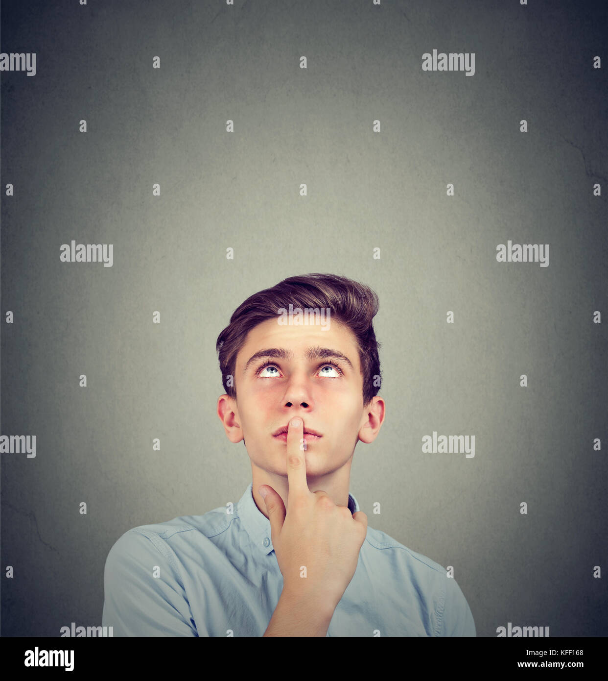 Thoughtful young man looking up Stock Photo - Alamy Thoughtful young man looking up Stock Photo - Alamy