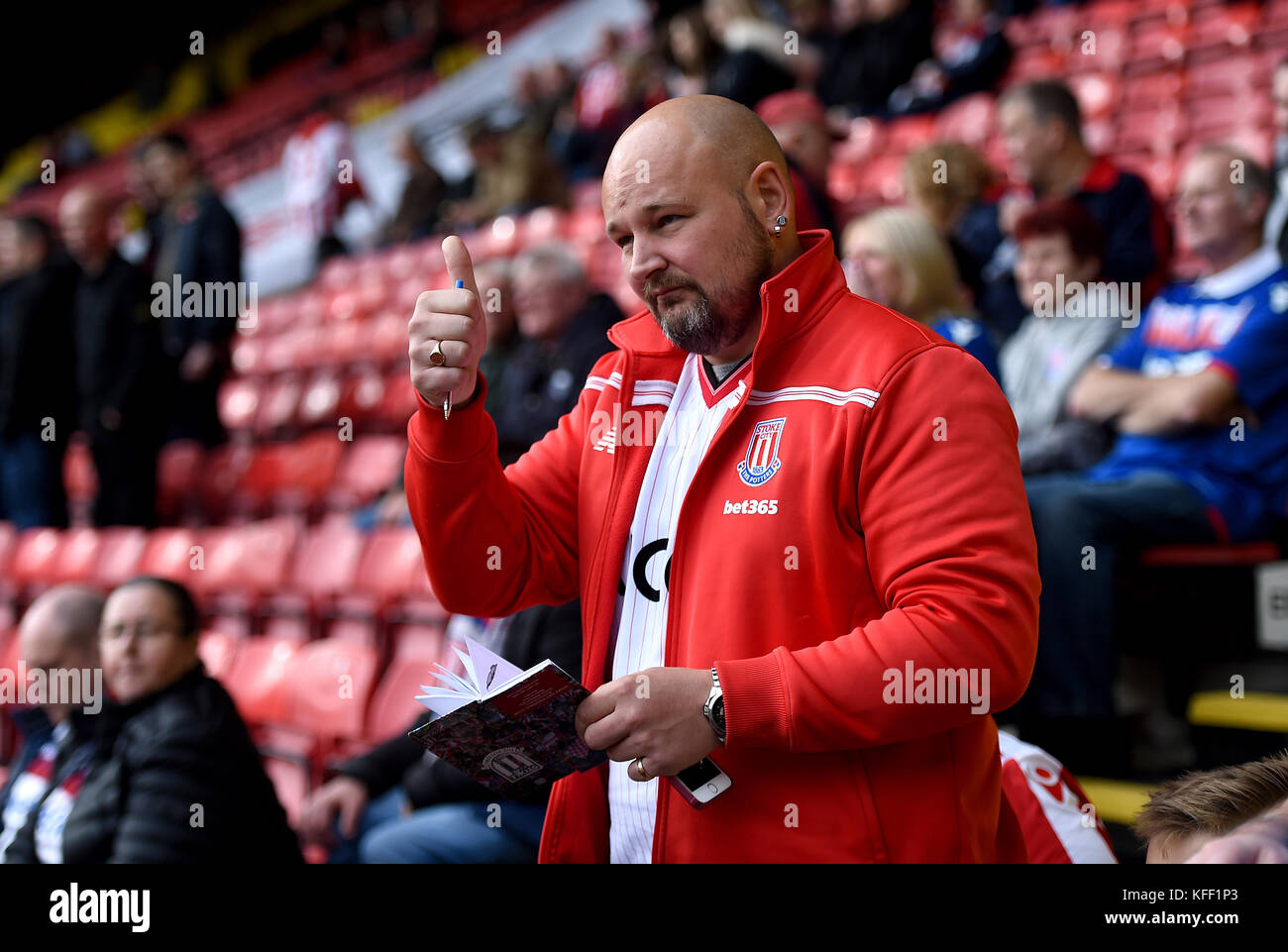 A Stoke City fan in the stands during the Premier League match at ...