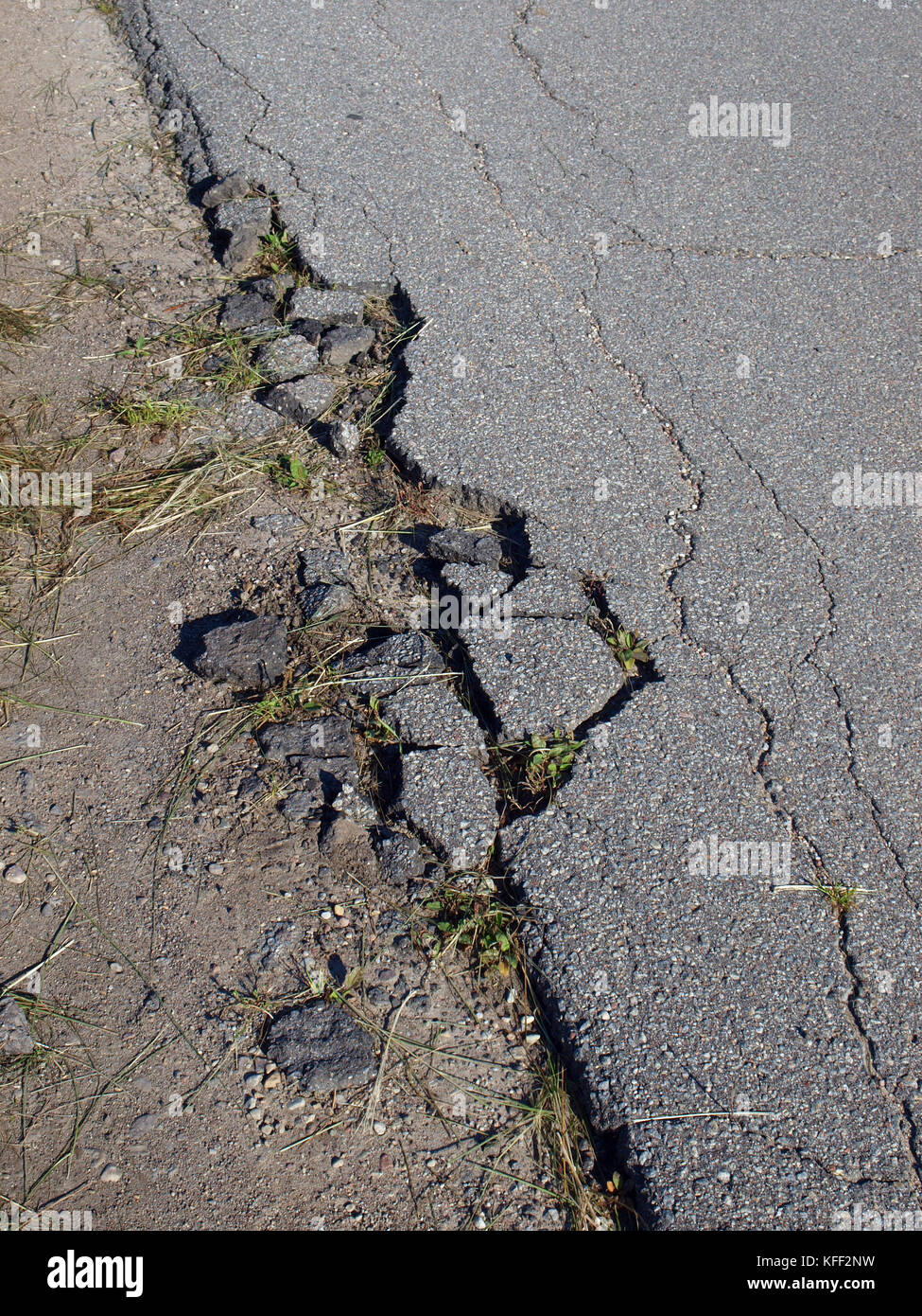 Crashed asphalt on road edge, close up Stock Photo - Alamy
