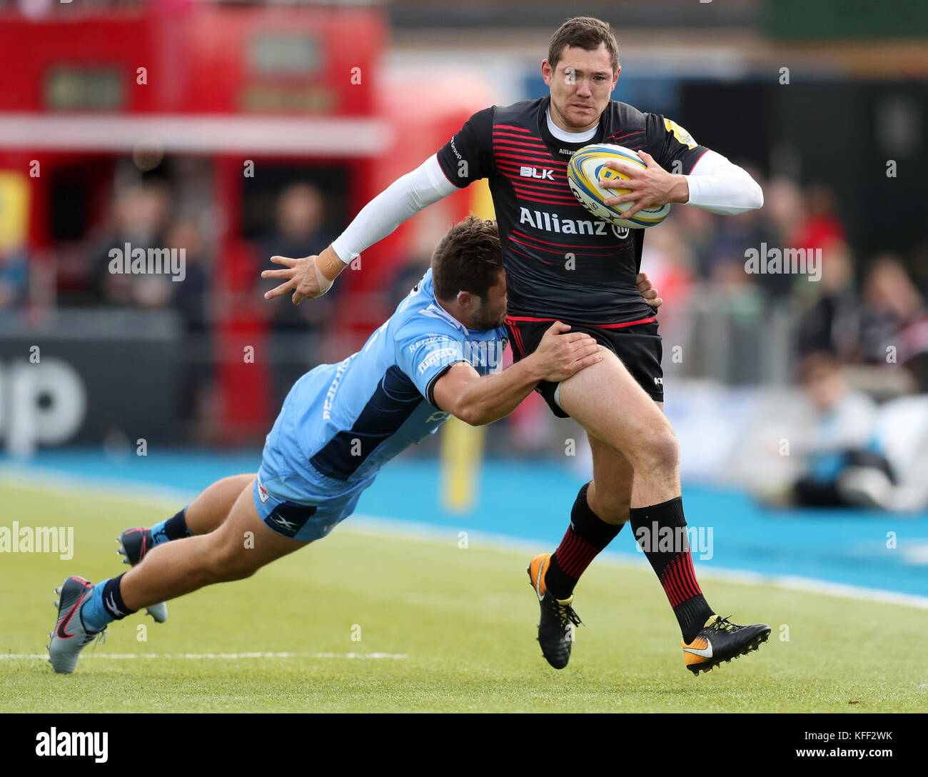 Saracens' Alex Goode is tackled by London Irish's Tom Fowlie during the ...