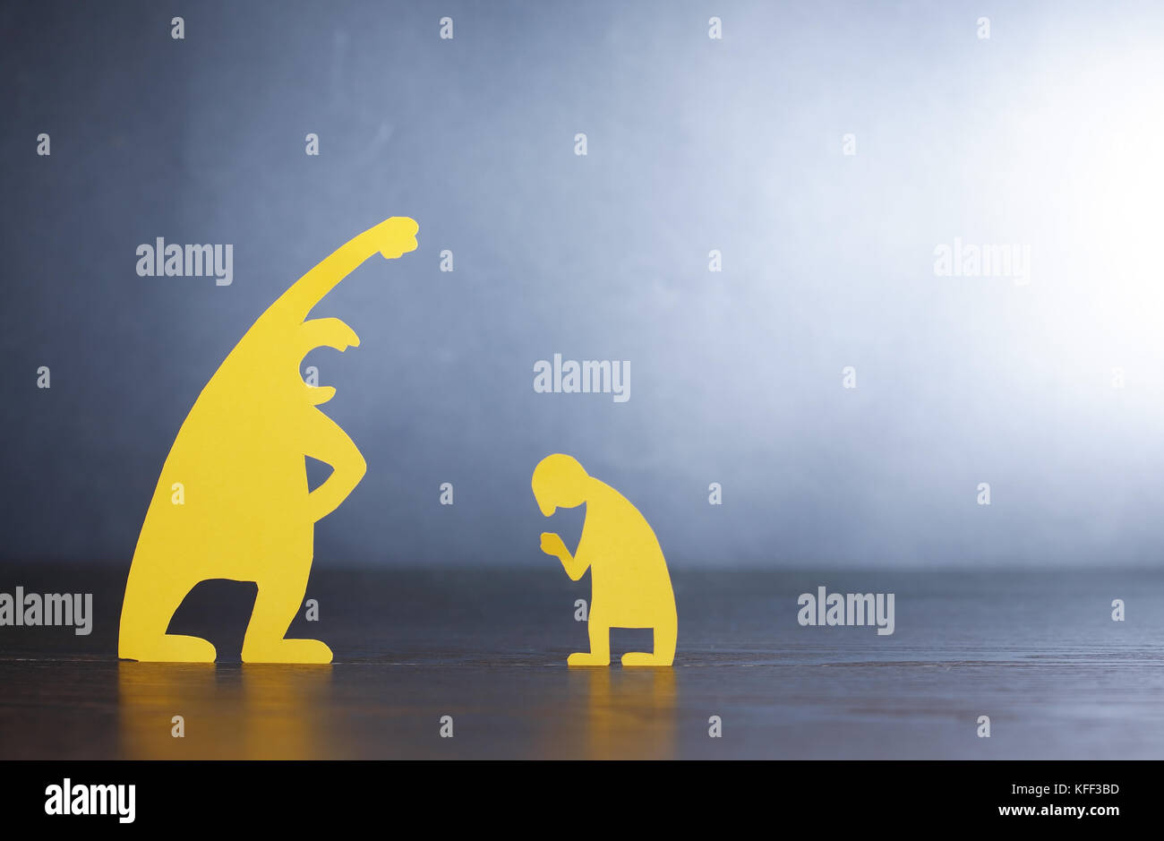 Big screaming man against small miserable man made from yellow paper ...