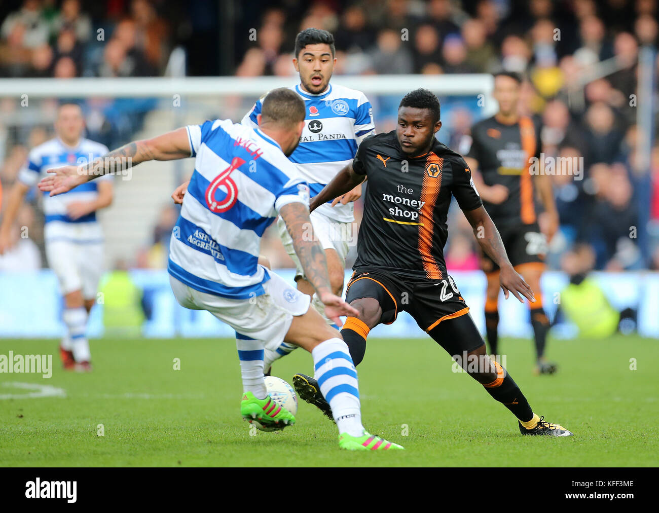 Wolves Connor Ronan (right) and QPR’s Joel Lynch battle for the ball ...