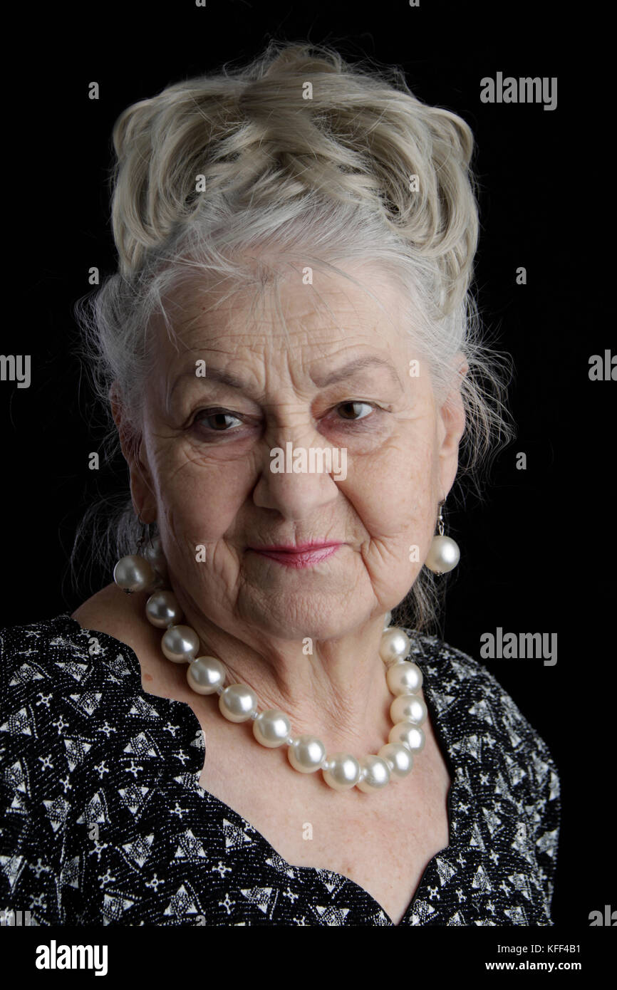 A very old woman. An eighty-year-old woman. Studio portrait of an old ...