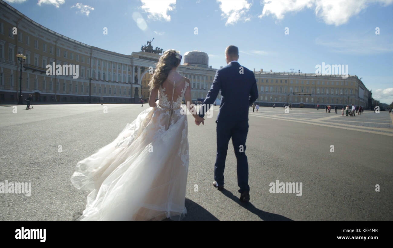 St Petersburg, Russia Bride and groom walking along. the bride and ...