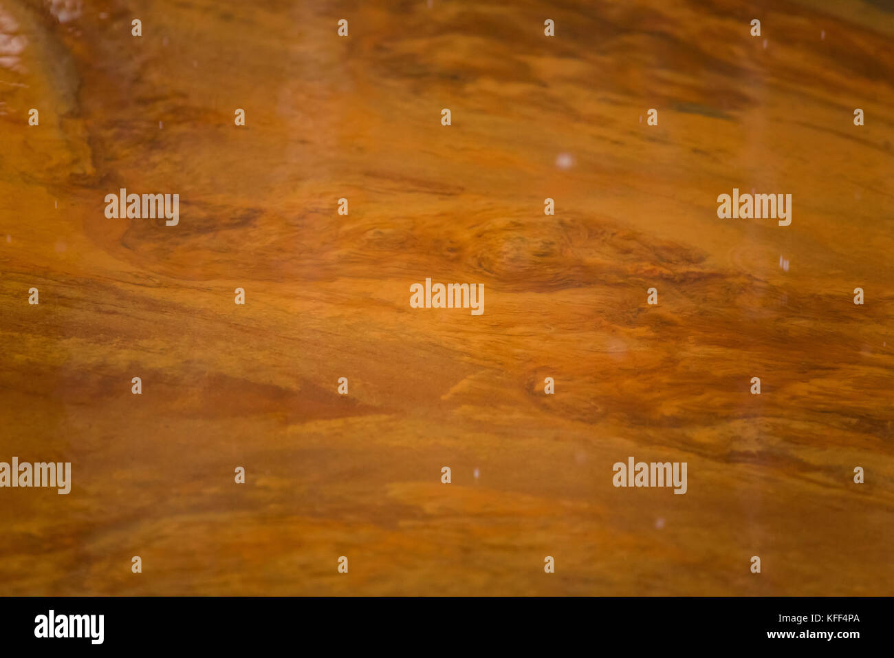 An orange rusty water at the old copper mine in Norway in winter ...