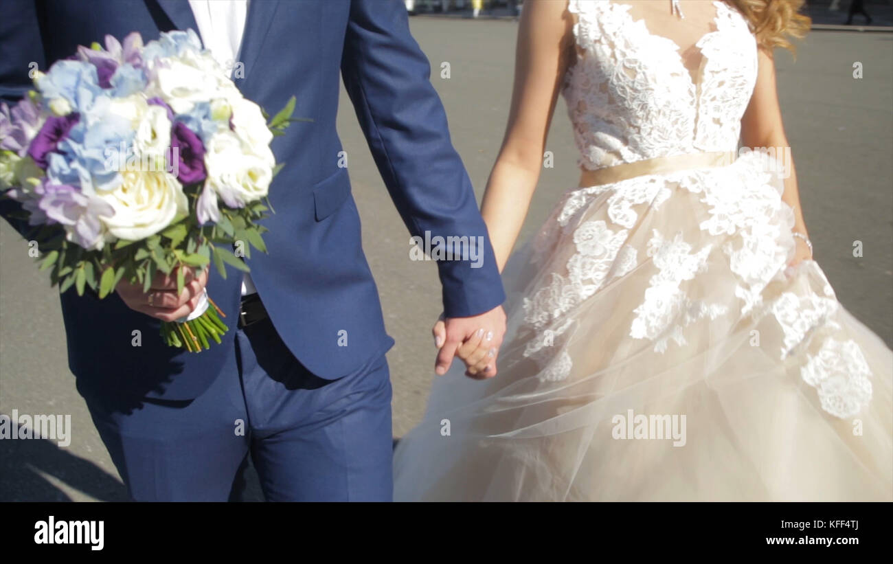St Petersburg, Russia Bride and groom walking along. the bride and ...