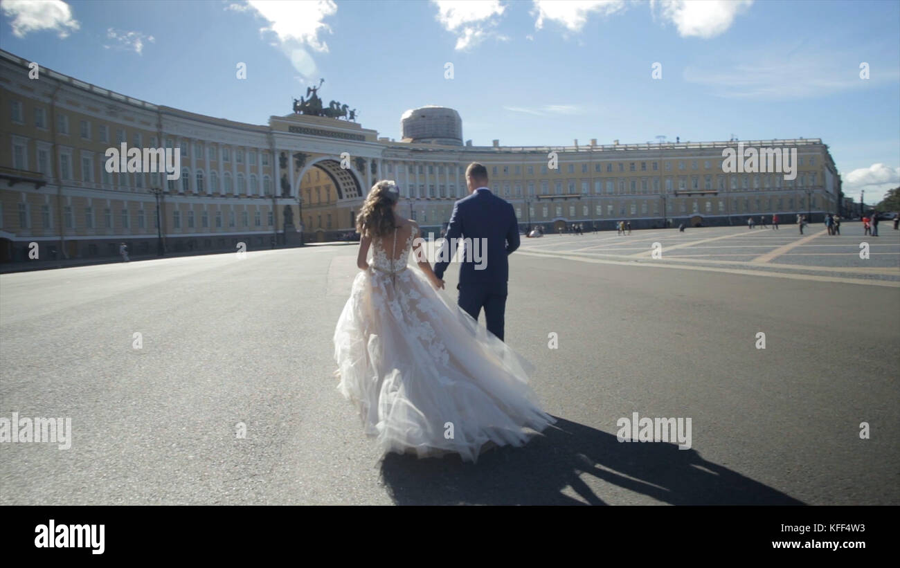 St Petersburg, Russia Bride and groom walking along. the bride and ...