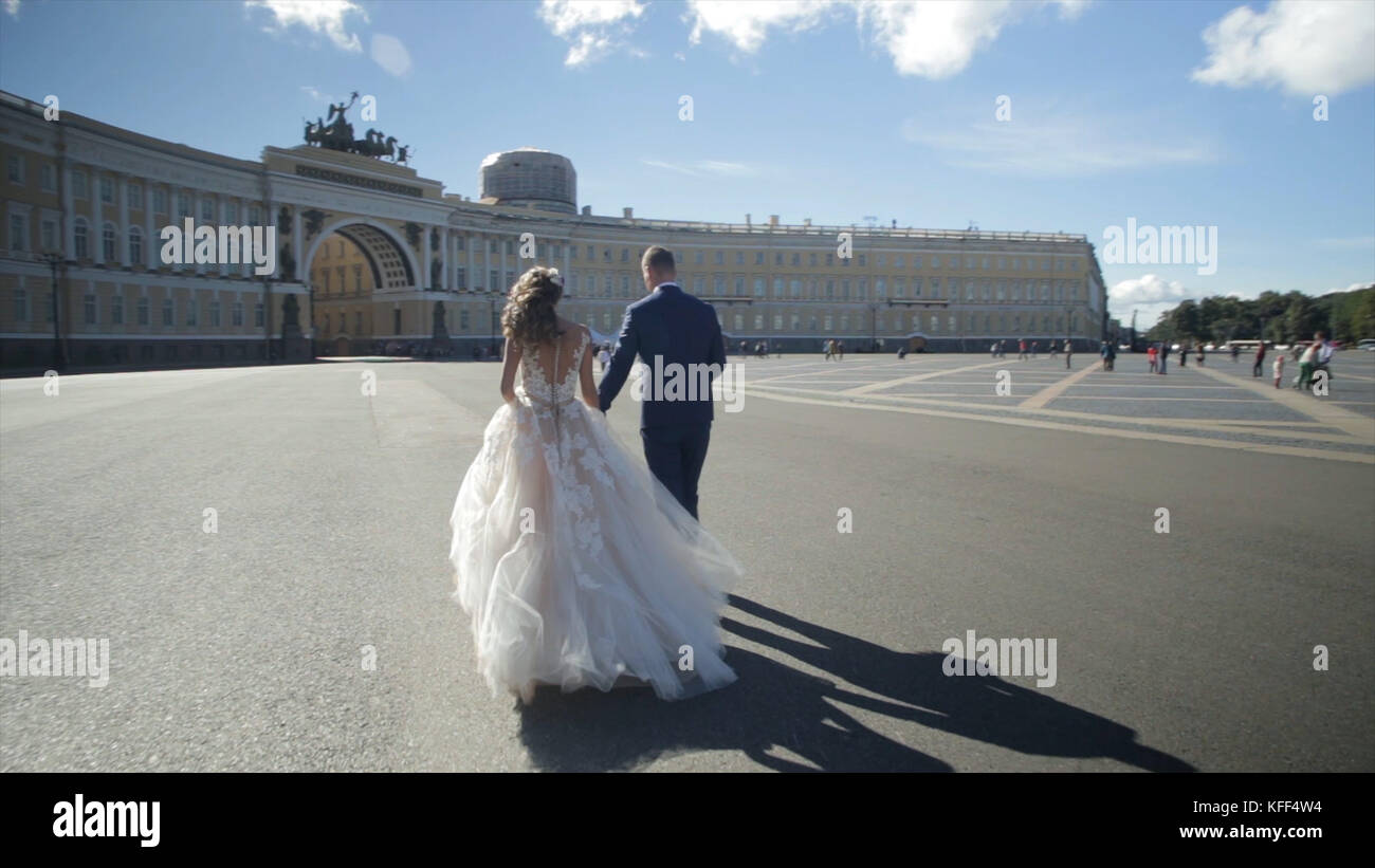 St Petersburg, Russia Bride and groom walking along. the bride and ...