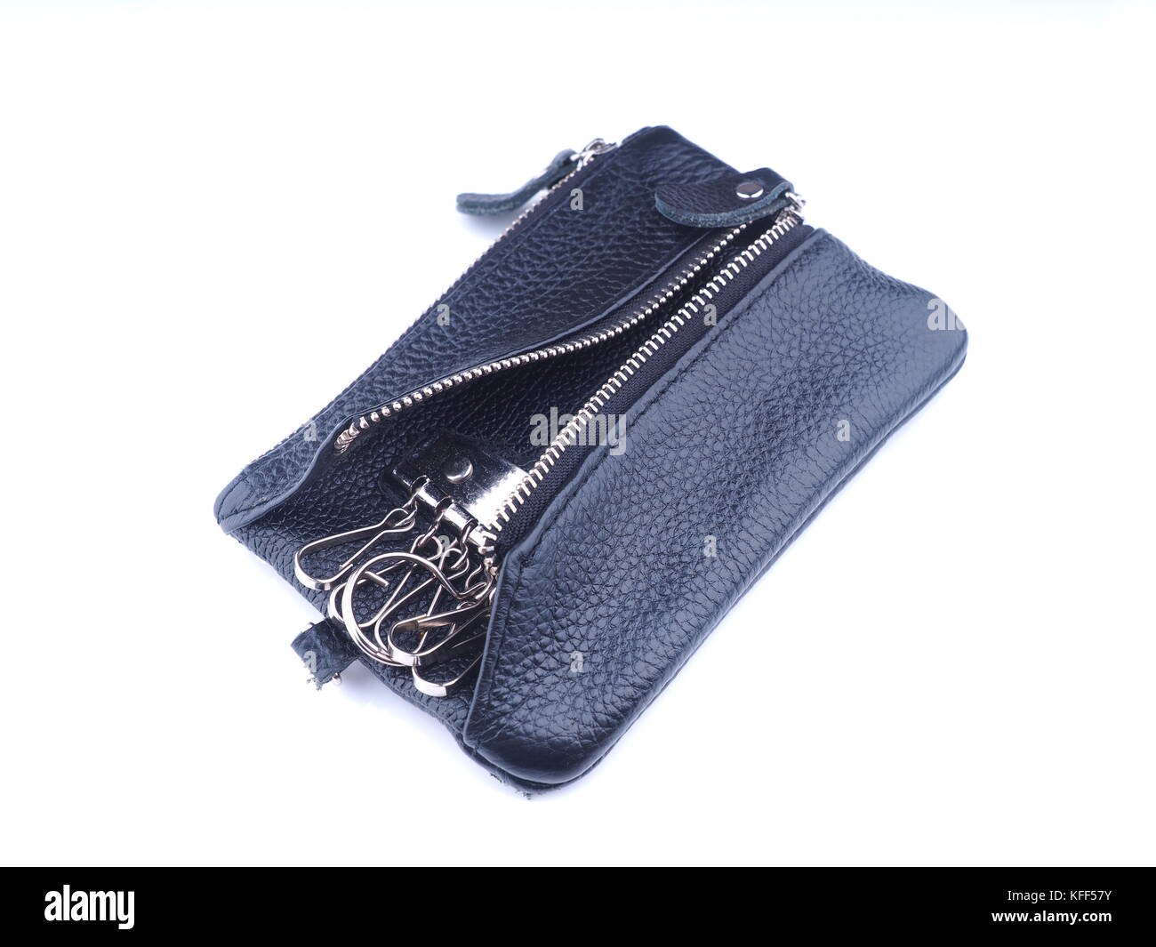 black purse with keys on a white background Stock Photo - Alamy