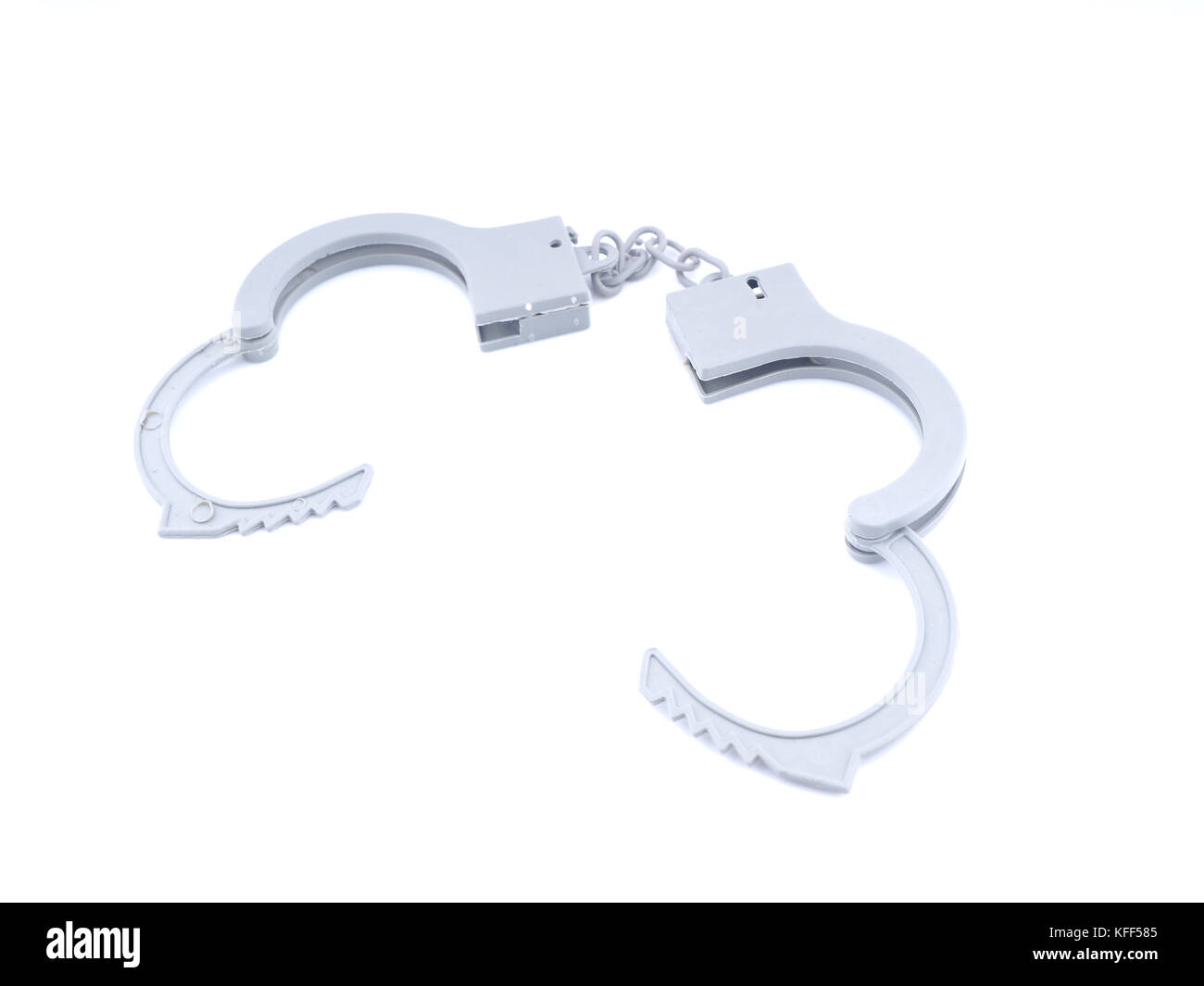 handcuffs on a white background Stock Photo - Alamy