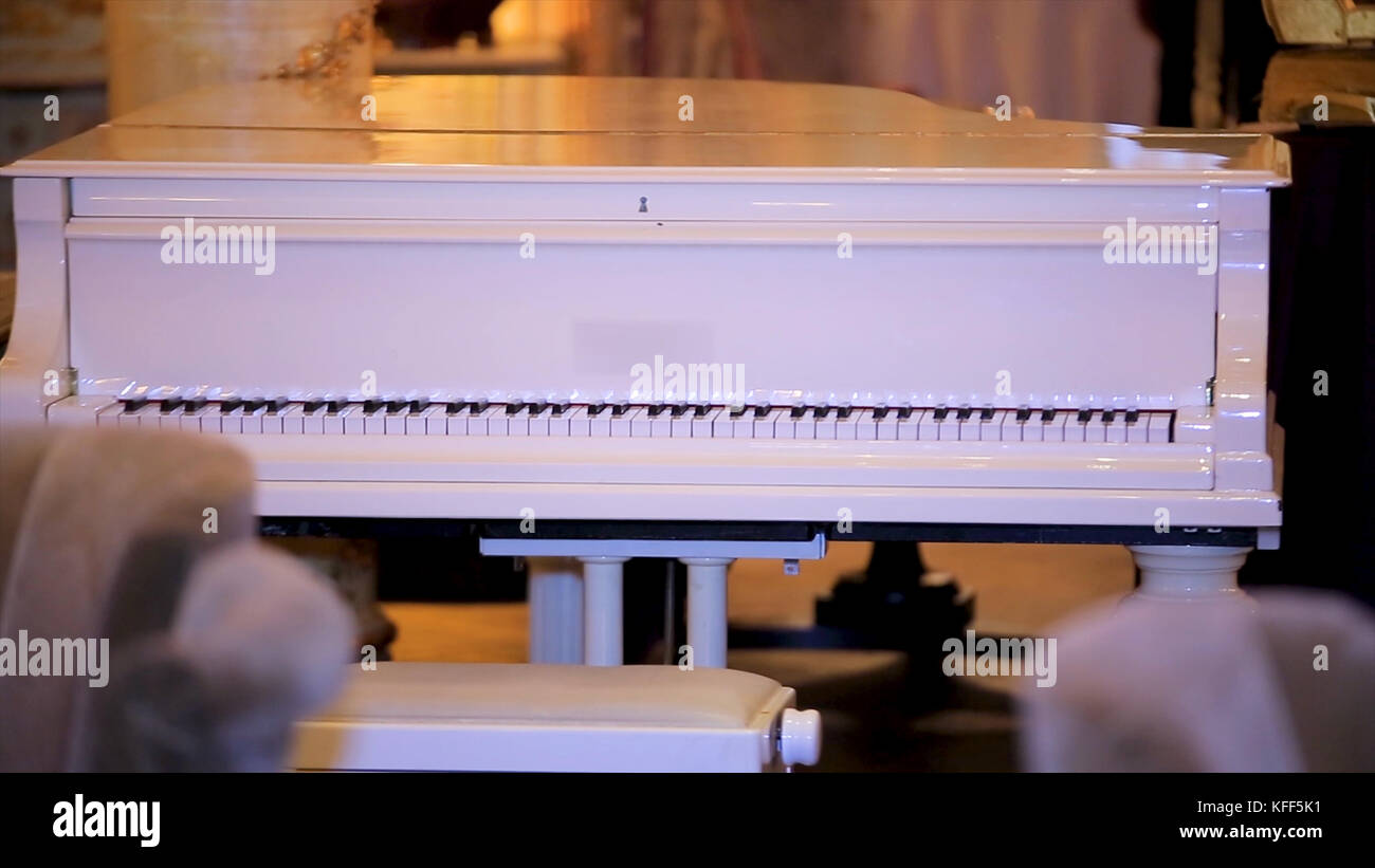 White piano. Whie piano Feurich. Piano vintage toning Stock Photo - Alamy