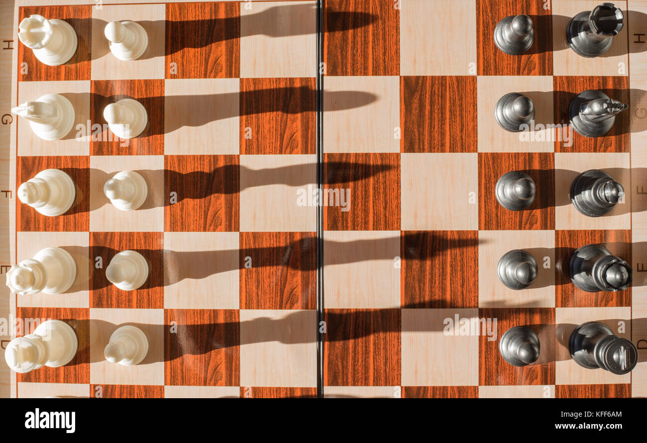 Section foldable chessboard top view, white on the left Stock Photo - Alamy