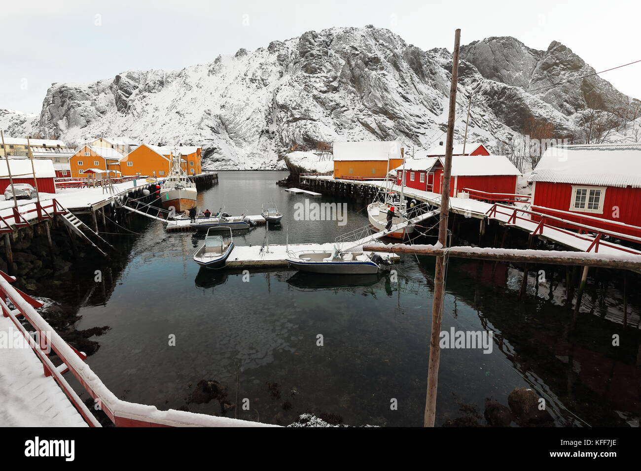 N.E.-wards view over the snow covered harbor with floating moorings and ...