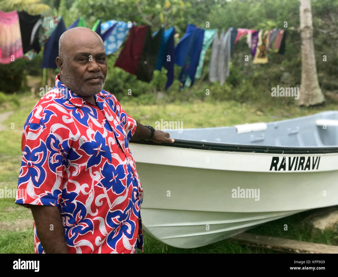 Saimoni Vatu stands in front of a boat in the town of Narikoso on the ...
