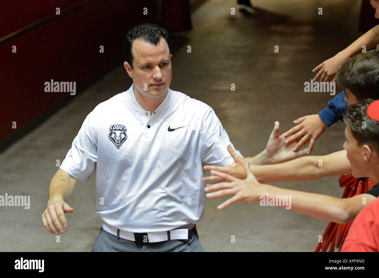 Albuquerque, NM, USA. 27th Oct, 2017. UNM's coach Paul Weir is greeted ...