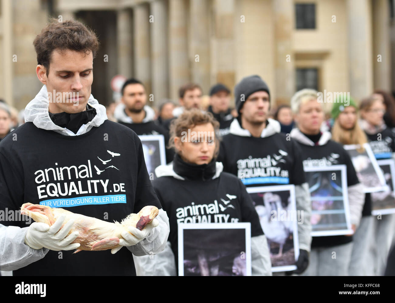 Animal rights activists from the group Animal Equality hold dead ...