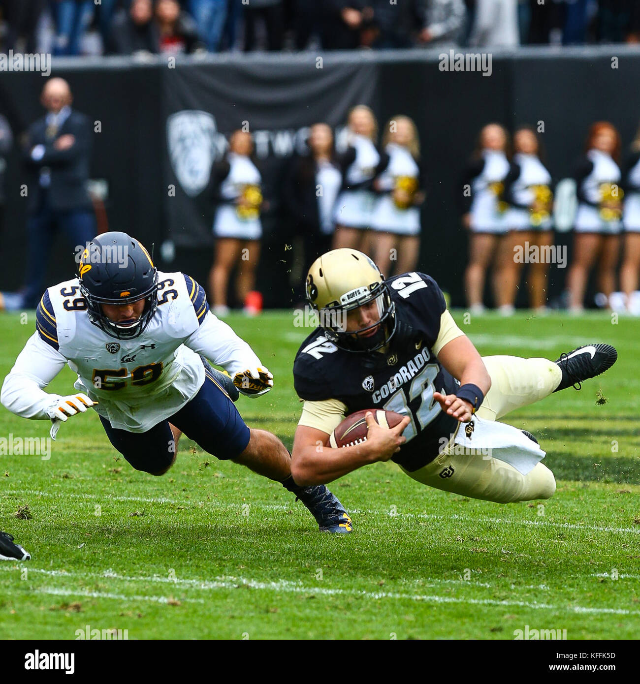 The First Half. 28th Oct, 2017. Colorado QB Steven Montez is tripped up ...