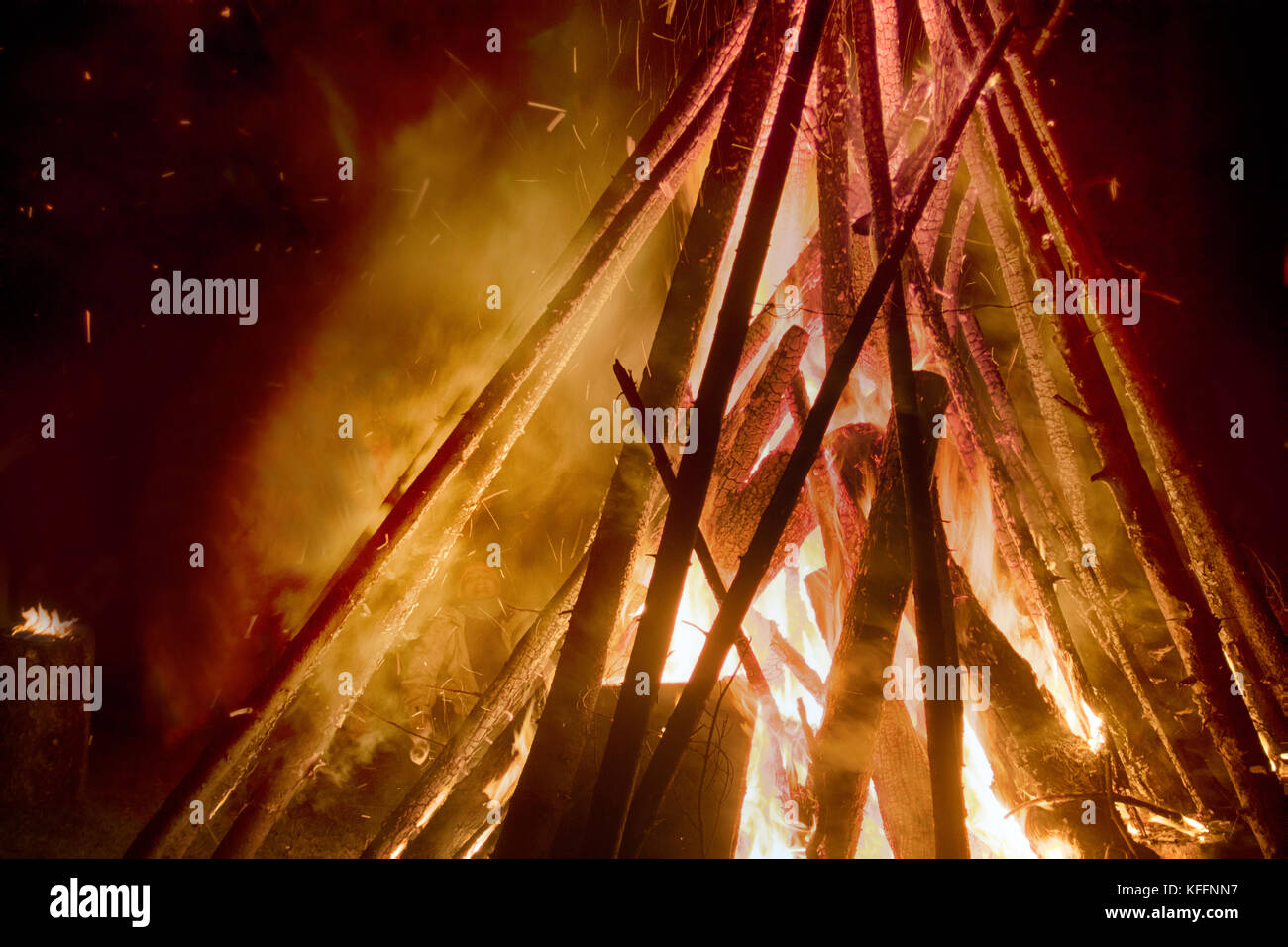 Element of fire, huge night fire on holiday. Dance sparks, Pyromania ...