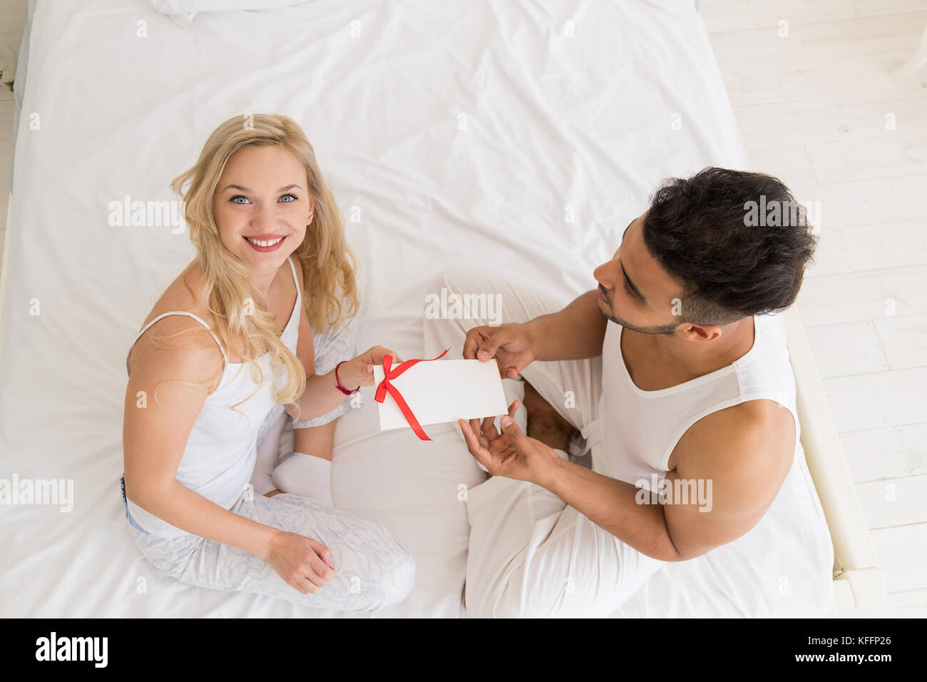 Couple bed surprise hi-res stock photography and images - Alamy