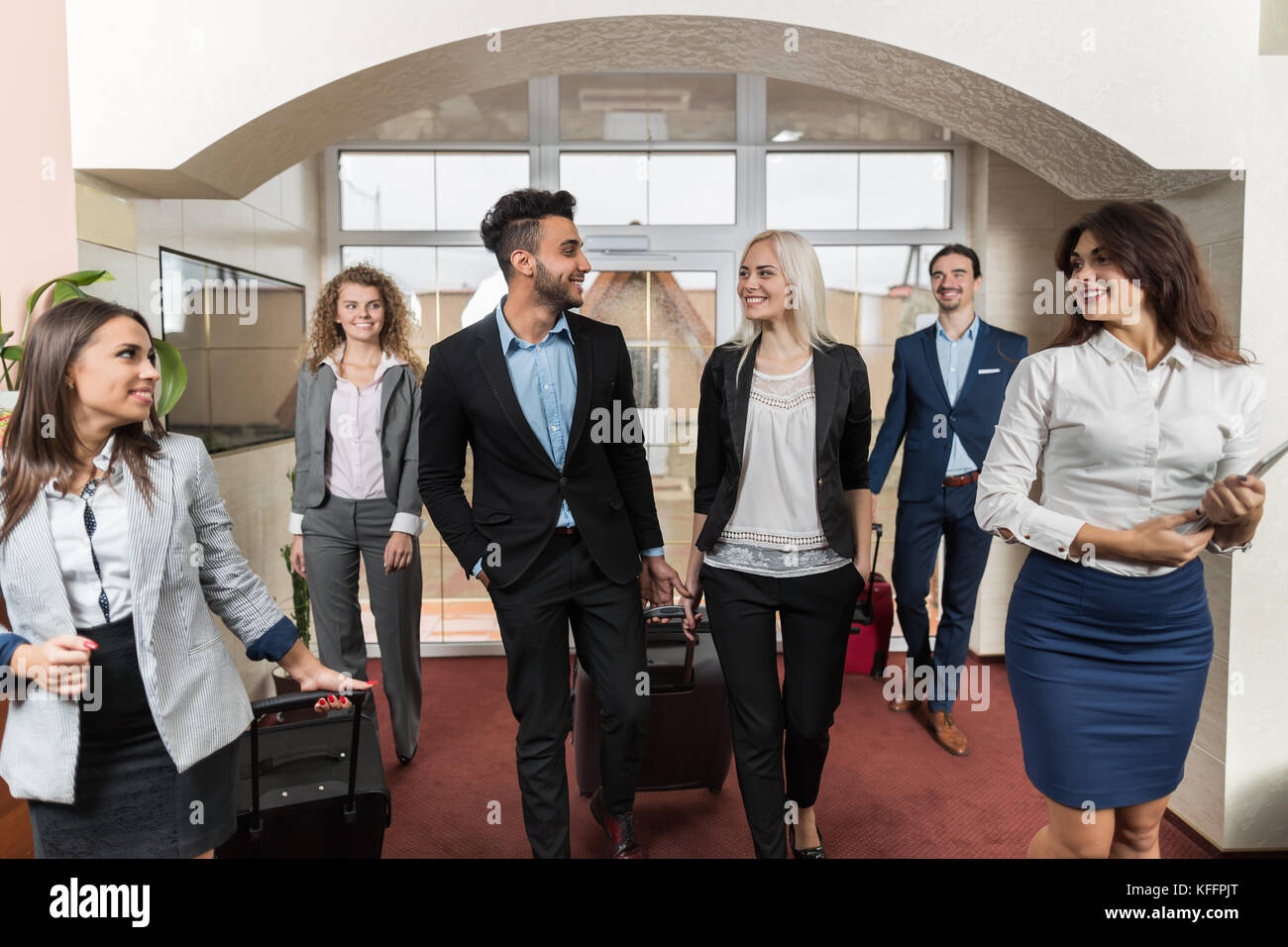 Hotel Receptionist Meeting Business People Group In Lobby Stock Photo ...