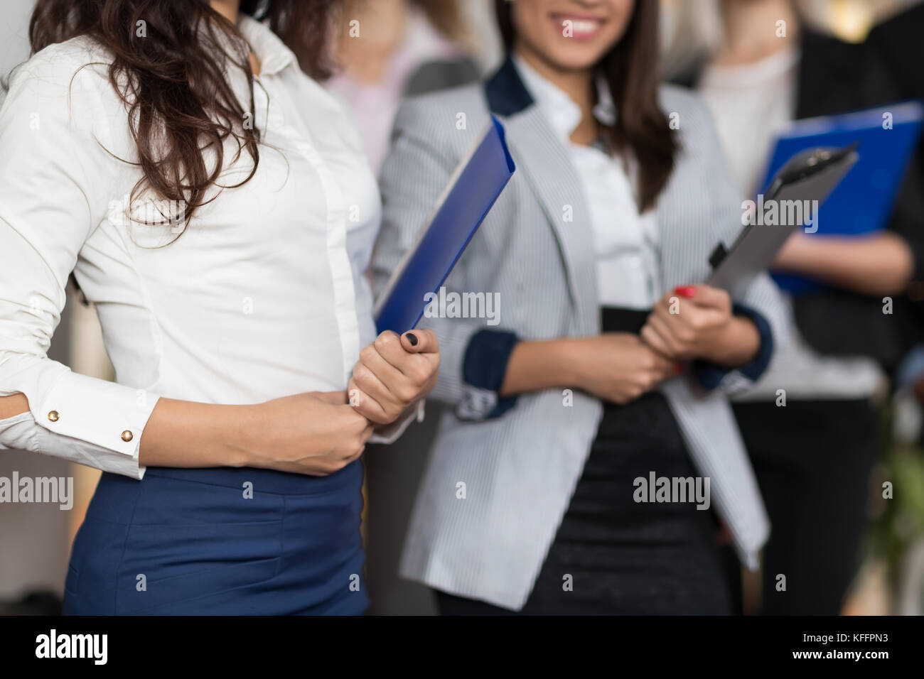 Hotel Administrator Meeting Business People In Lobby, Woman ...