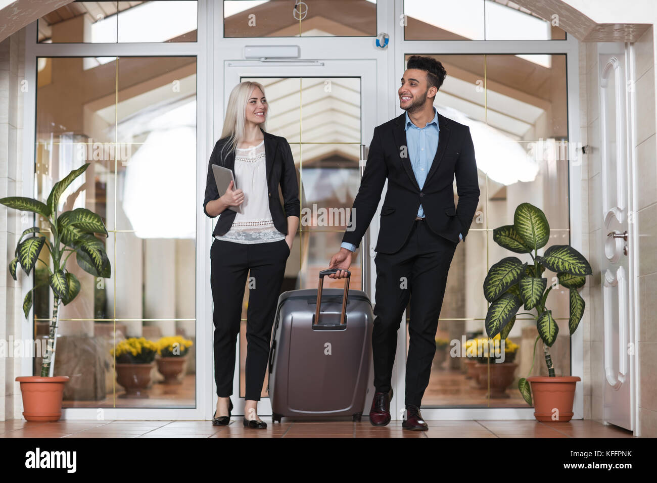 Business Couple In Hotel Lobby, Businesspeople Group Man And Woman ...