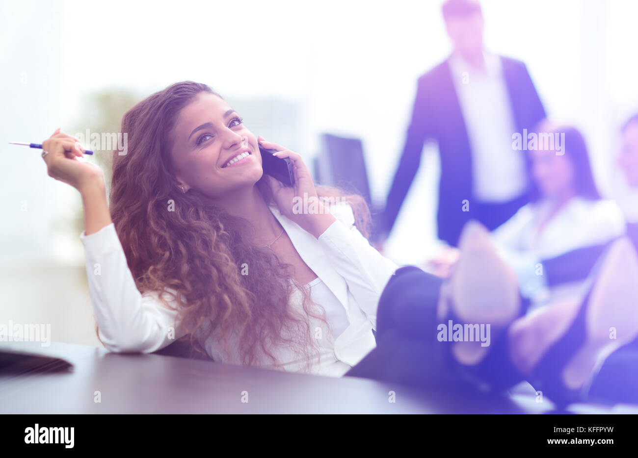 close up of a girl clerk in the workplace, put my feet up on the Desk ...